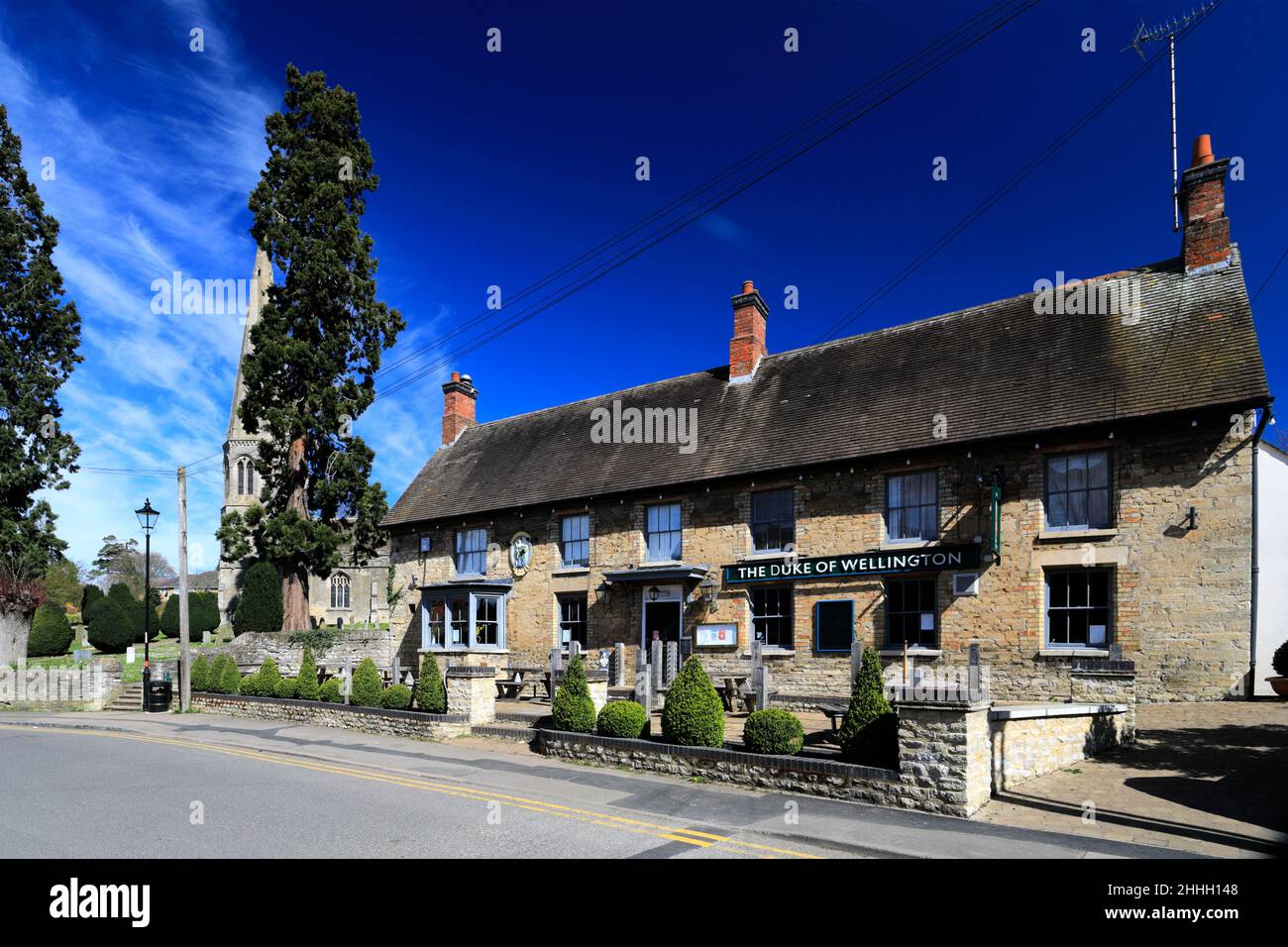 The Duke of Wellington pub and St Lawrence church, Stanwick village ...