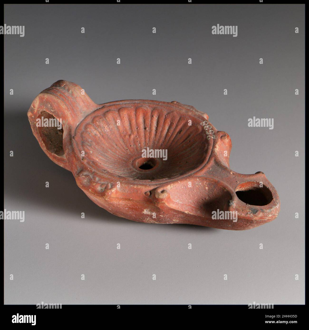 Terracotta oil lamp early 1st century A.D. Roman Mold-made, with ...