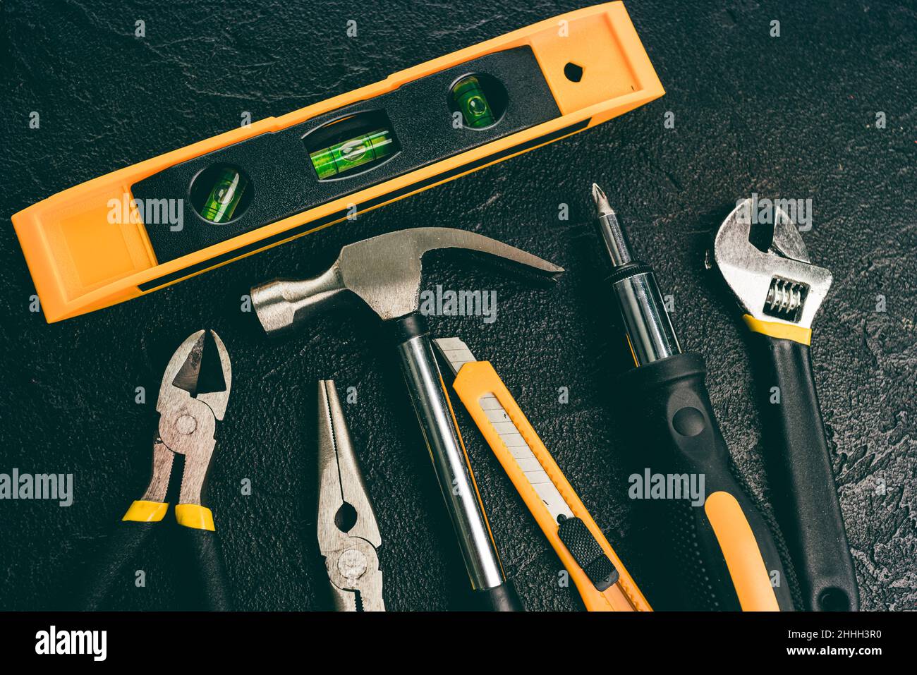 Tools for master builder on a black background Stock Photo - Alamy