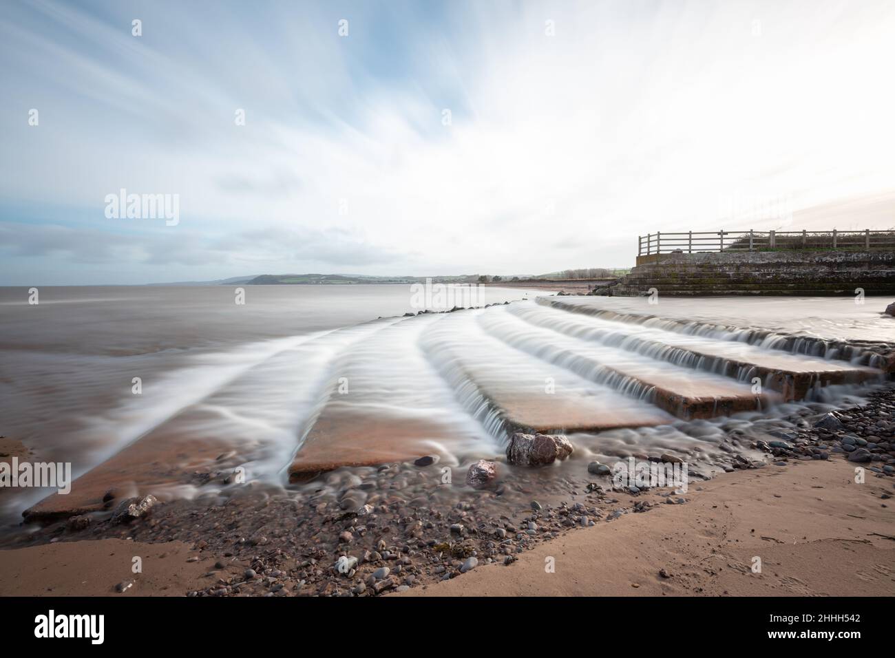 Long exposure of the waterfall from the river Avill flowing onto ...
