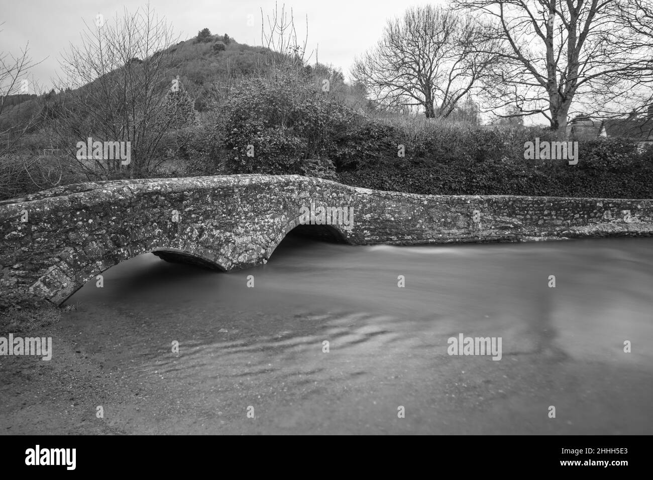 Long exposure of the river Avill flowing under Gallox bridge in Dunster ...