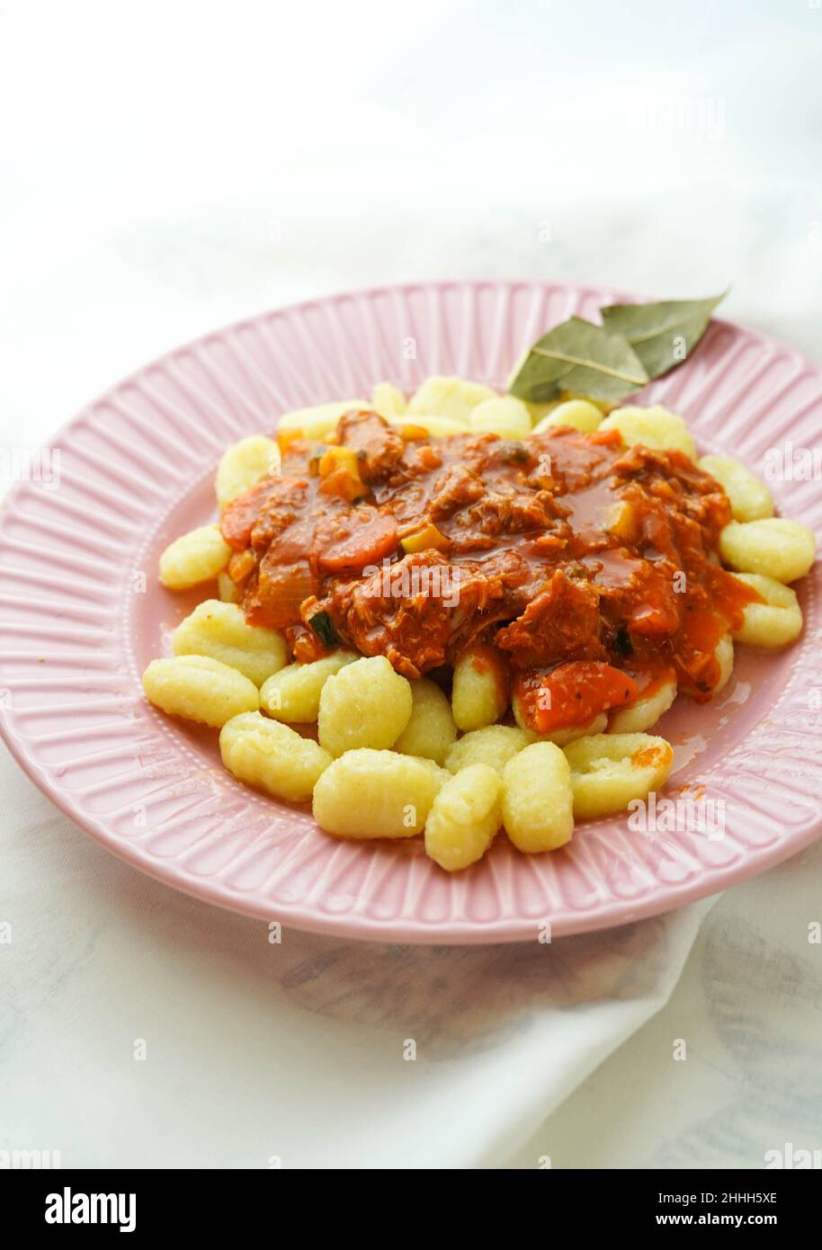 Plate of fresh gnocchi with tomato sauce and grated Parmesan cheese ...