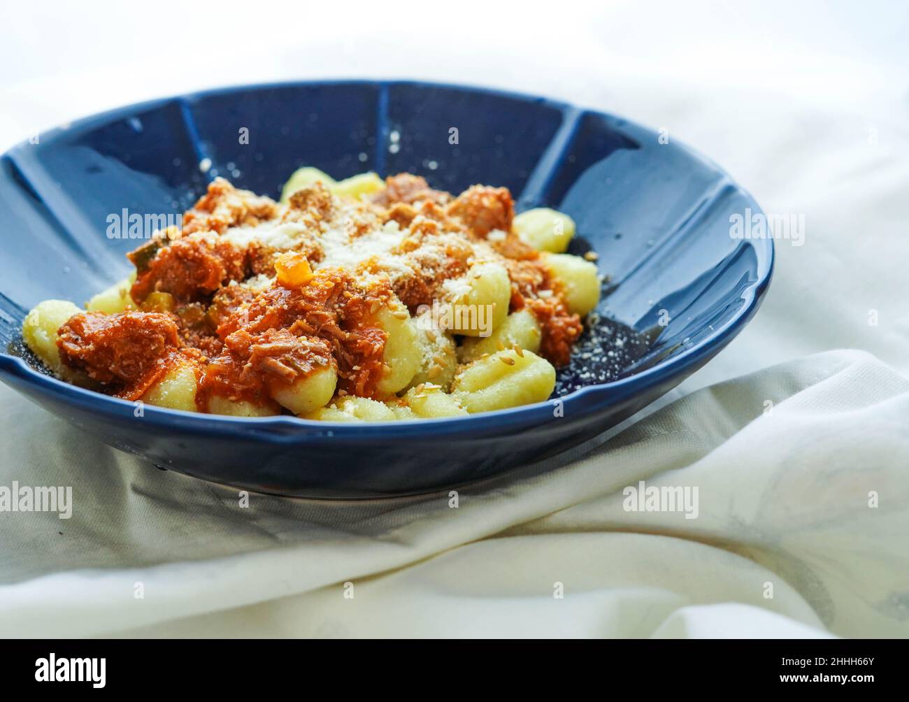Plate of fresh gnocchi with tomato sauce and grated Parmesan cheese ...