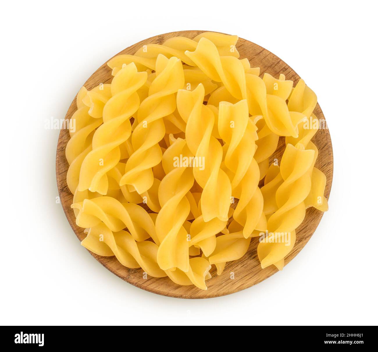 raw Fusilli pasta in wooden bowl isolated on white background with ...