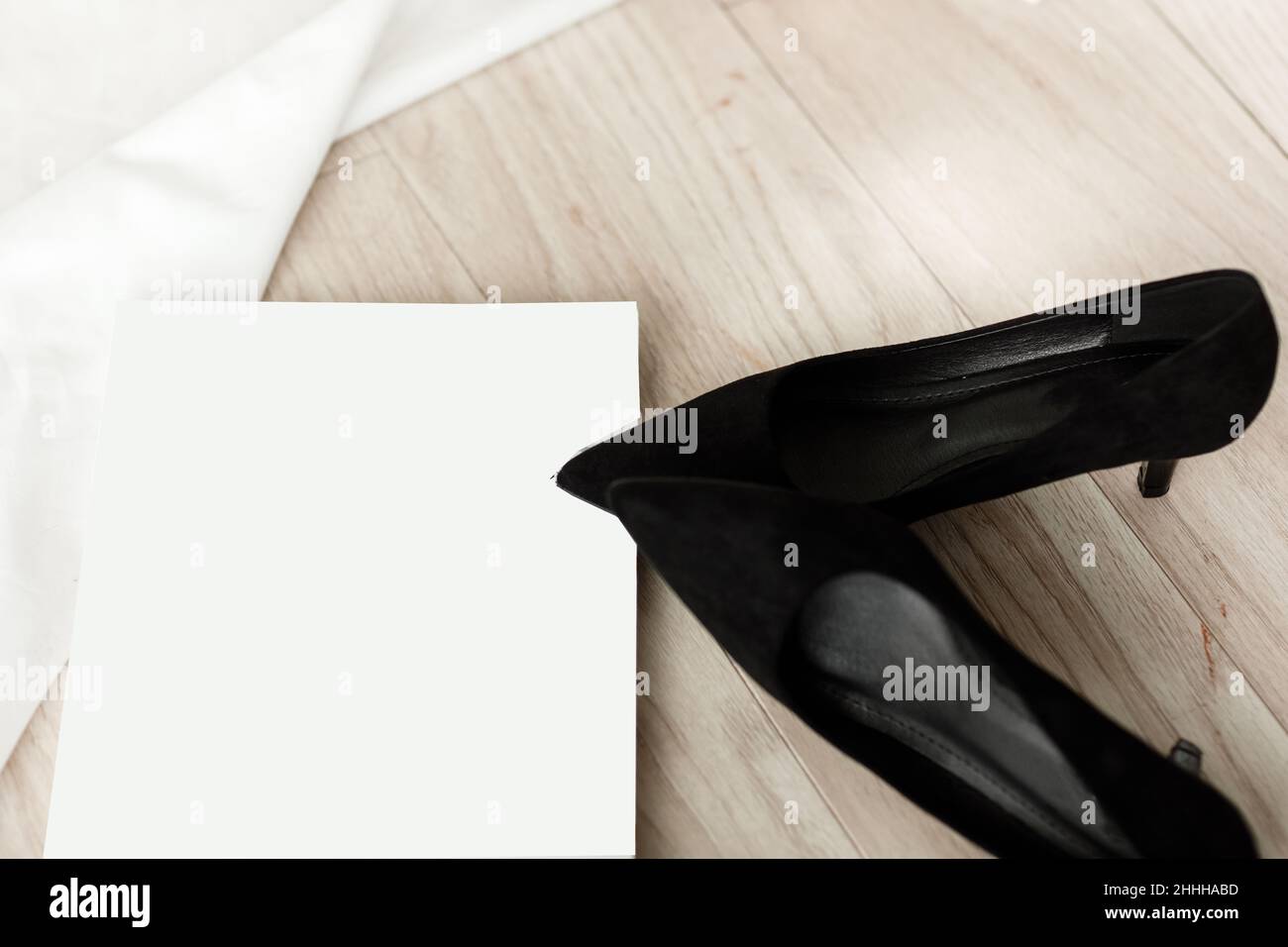 business woman accessories. black high heels and magazine with mock up ...