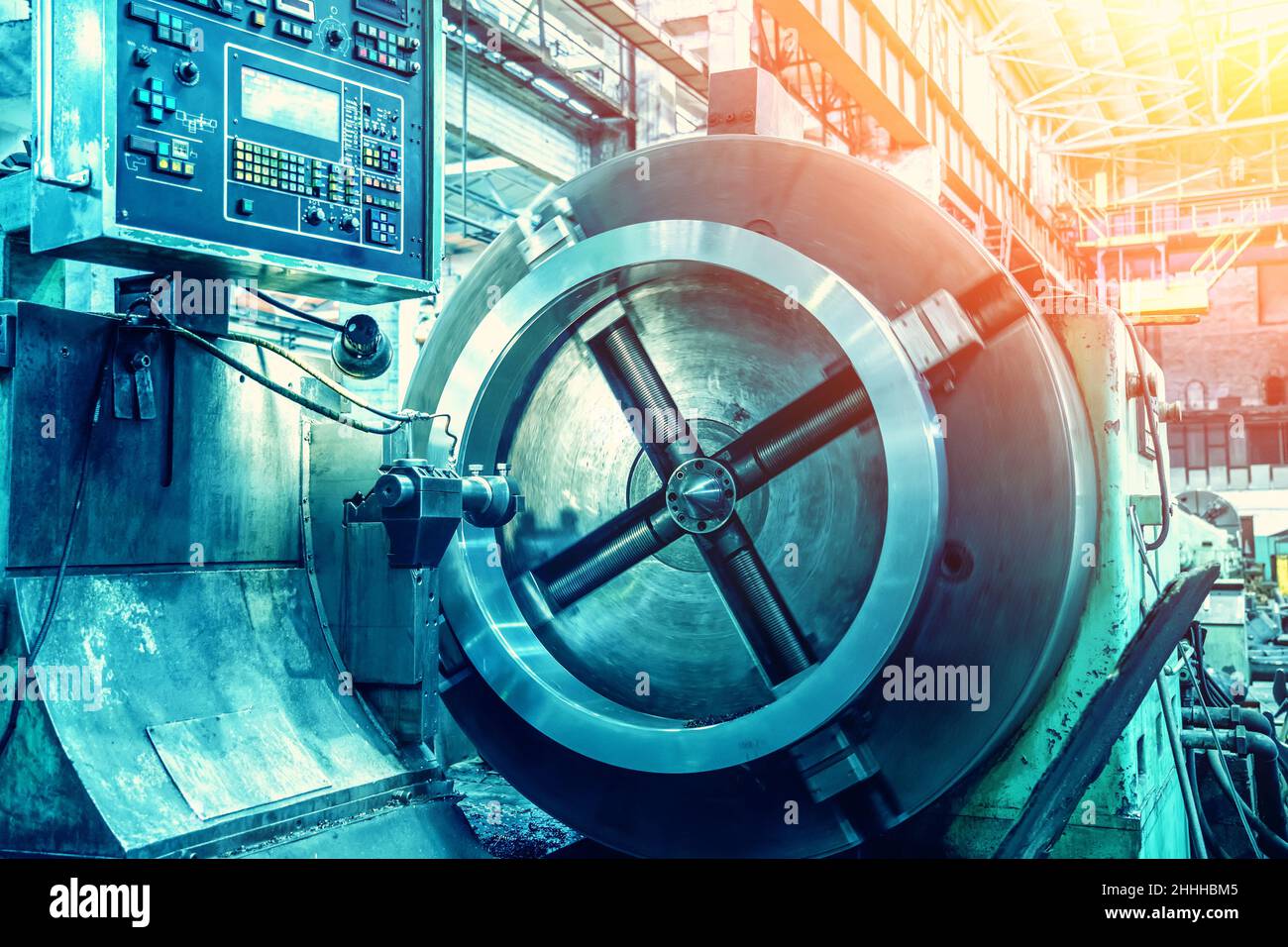 Automated CNC lathe machine tool in metalwork workshop. Modern ...