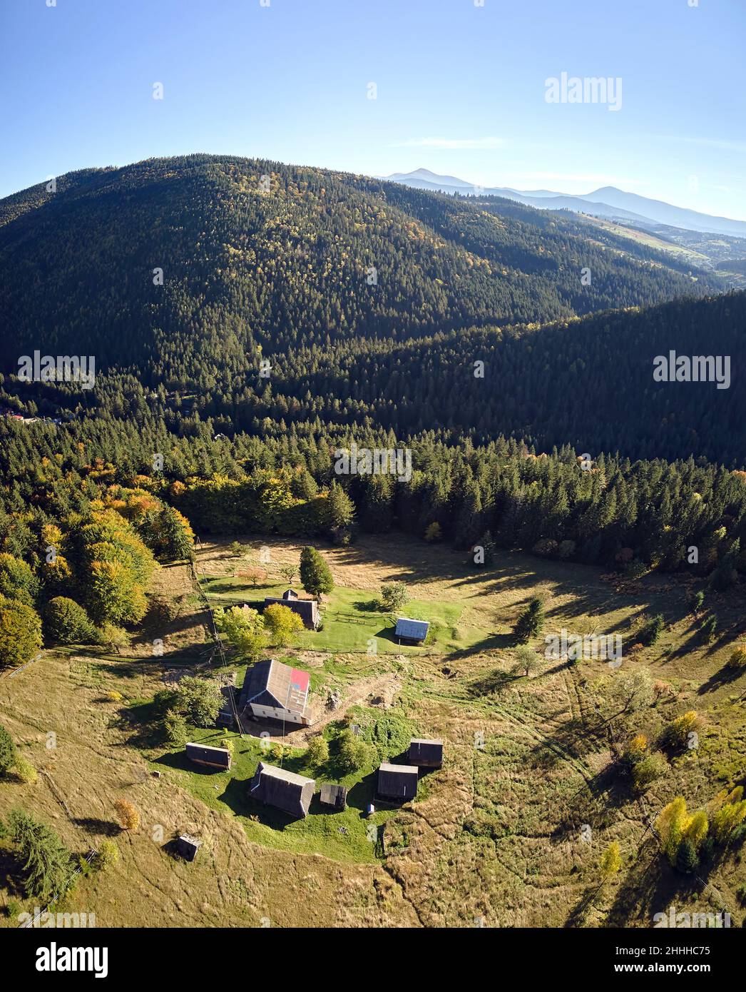 Aerial view of mountain hillside with small shepherd huts Stock Photo ...