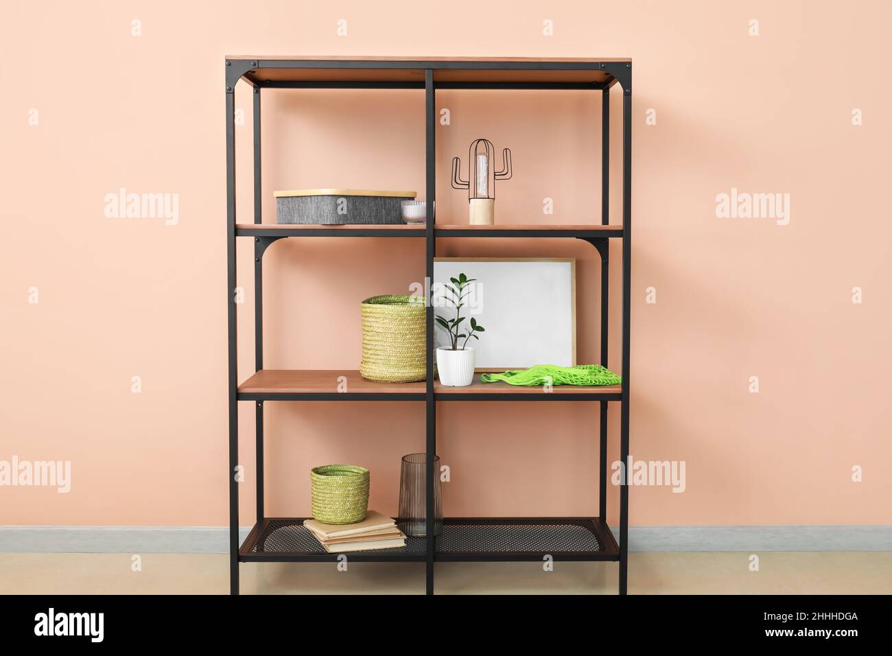 Modern shelf unit with stylish decor in room Stock Photo - Alamy