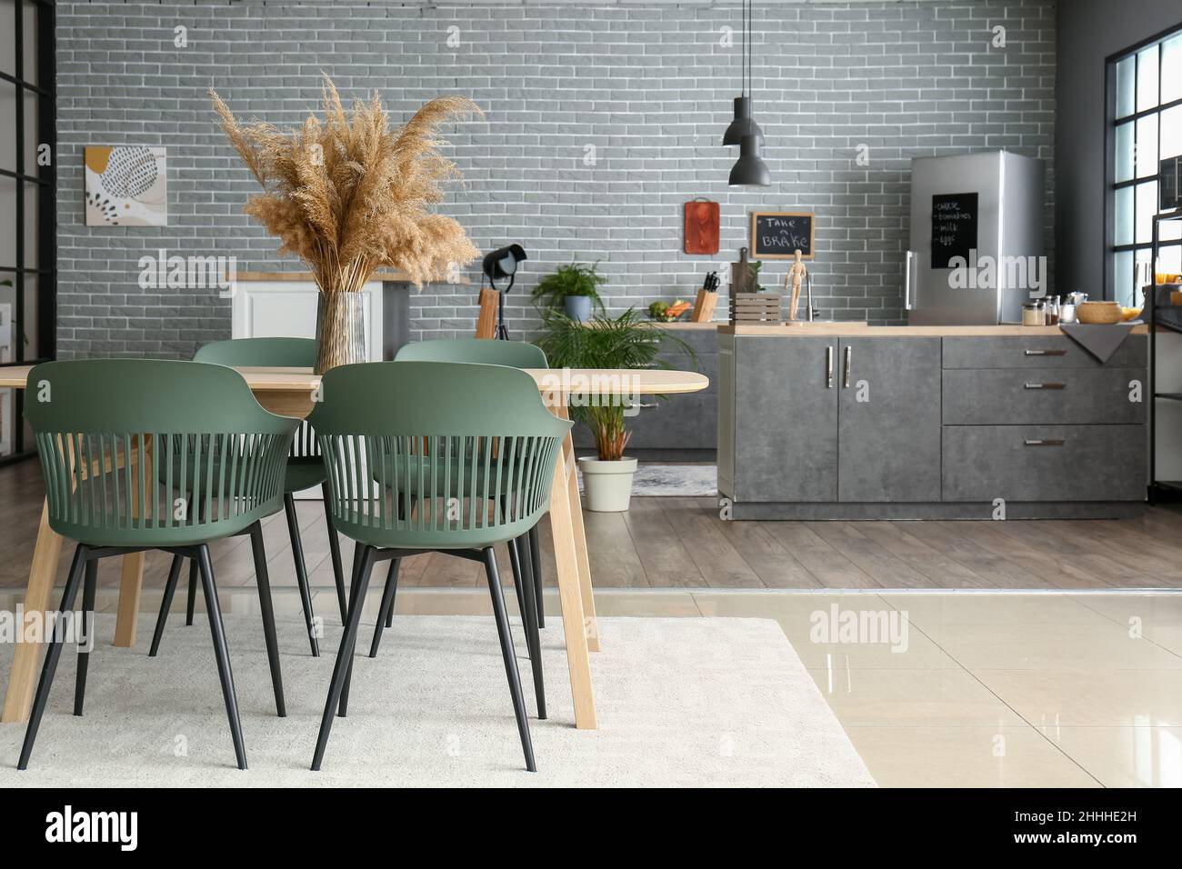 Dining table and chairs in modern kitchen Stock Photo - Alamy