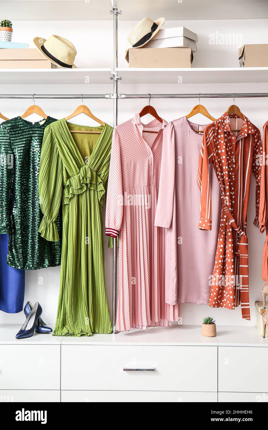 Elegant dresses and female accessories in dressing room Stock Photo - Alamy