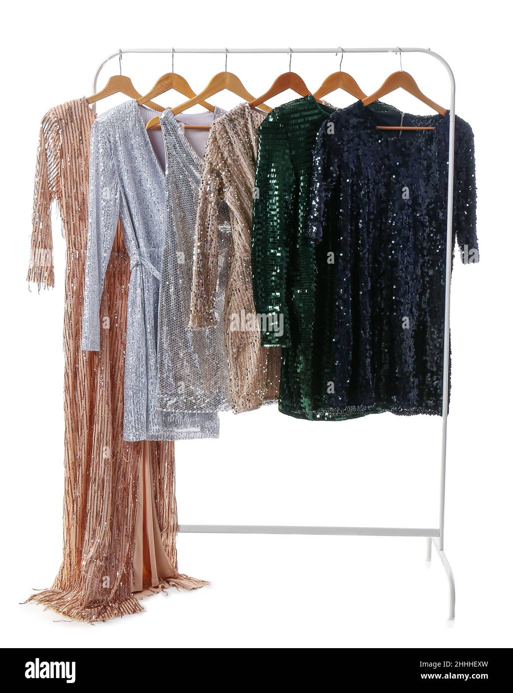 Rack with different stylish dresses on white background Stock Photo - Alamy