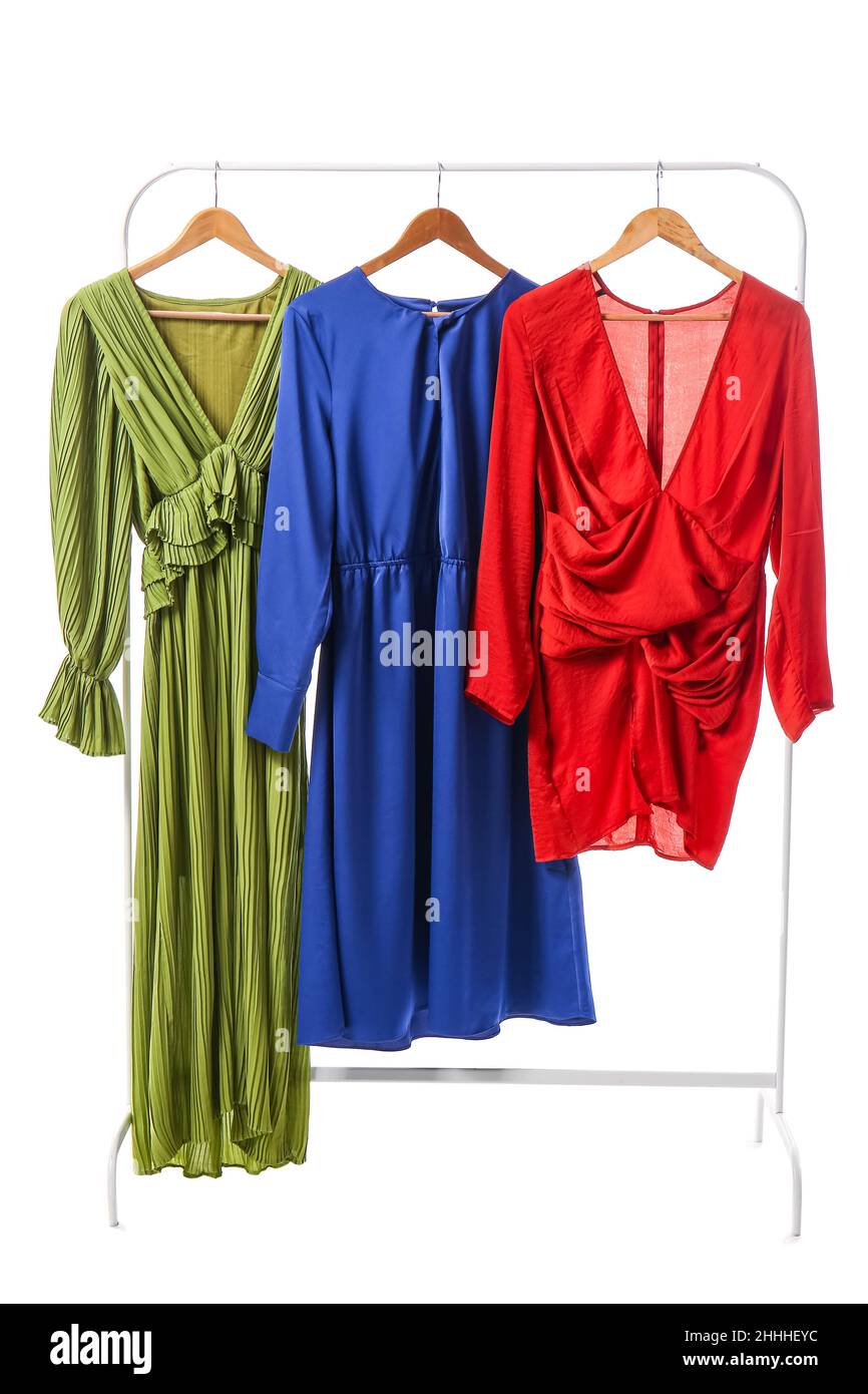 Rack with stylish dresses on white background Stock Photo - Alamy