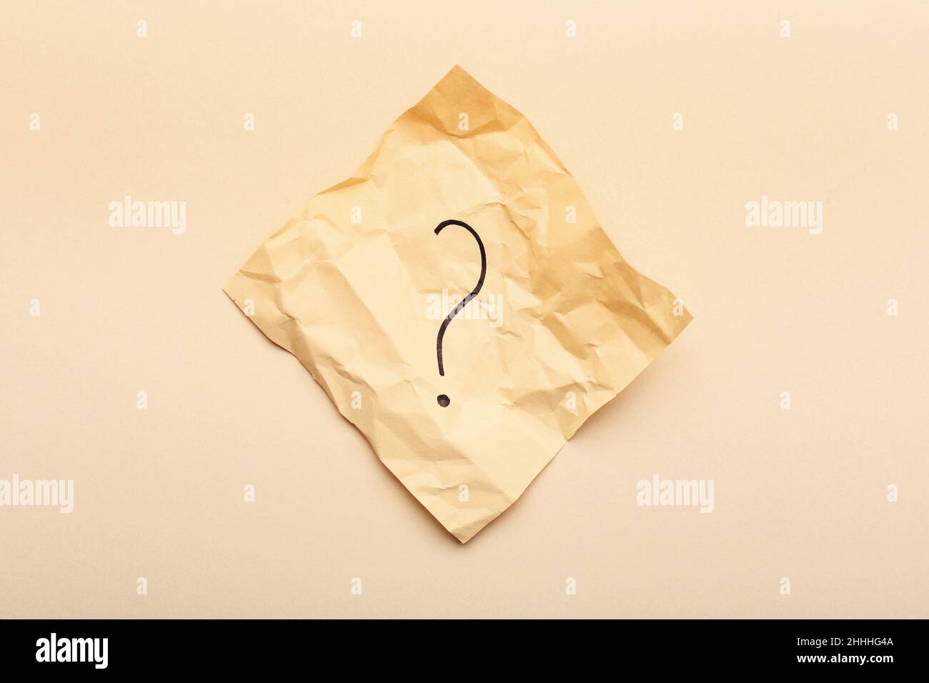 Paper stick with question mark on beige background Stock Photo - Alamy
