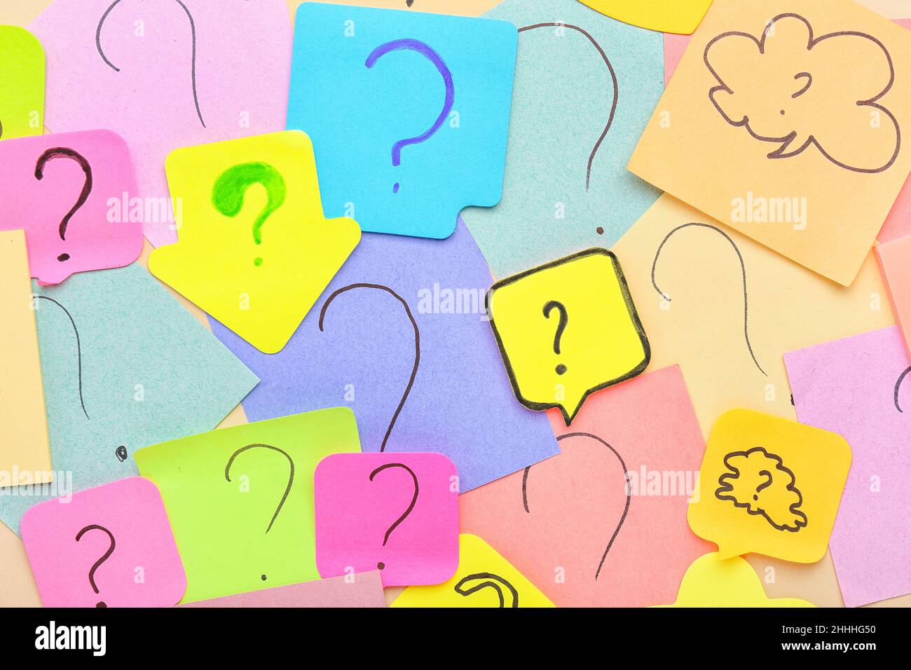 Paper sticks with question marks as background Stock Photo - Alamy