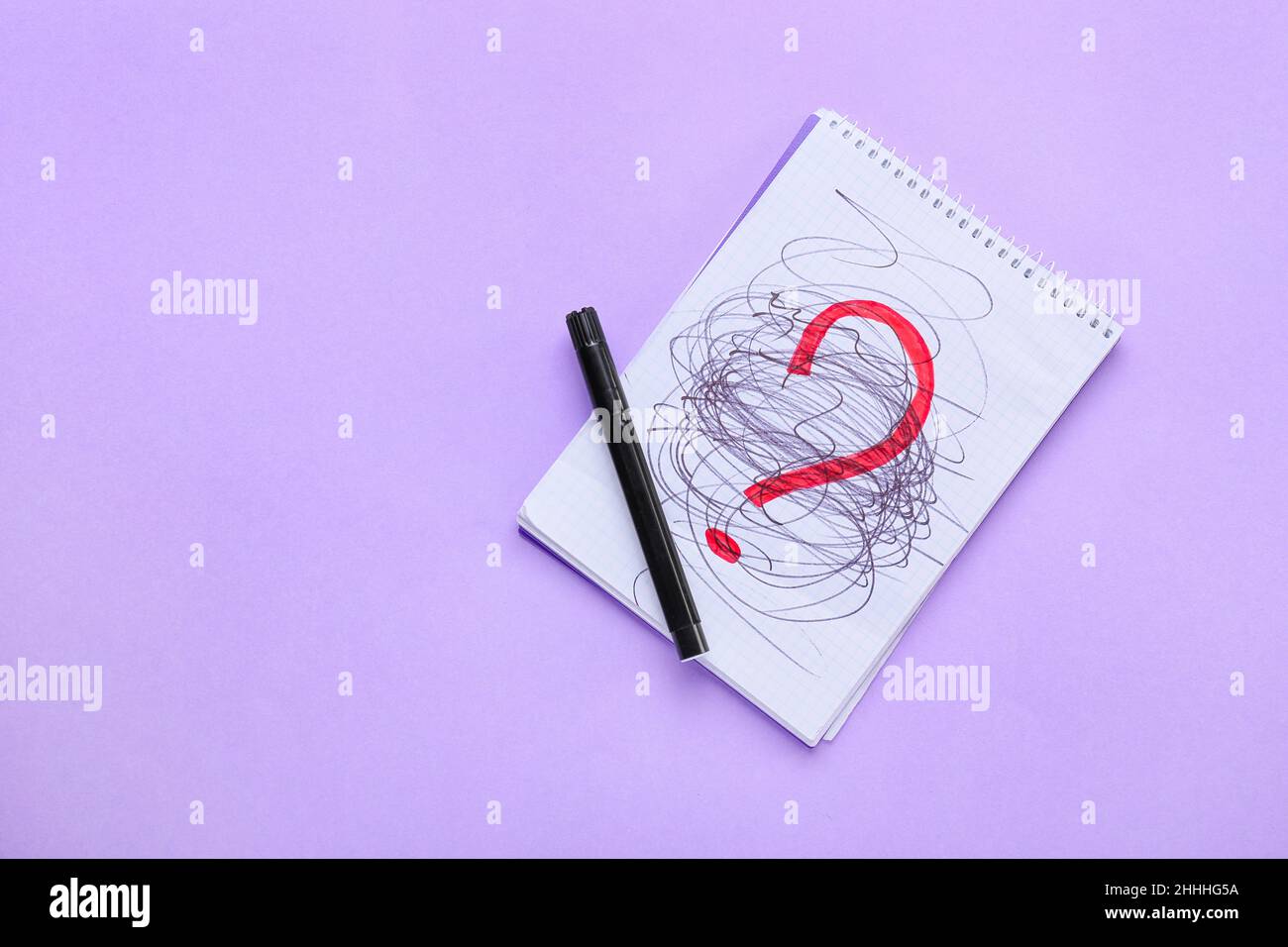 Notebook with question mark on purple background Stock Photo - Alamy