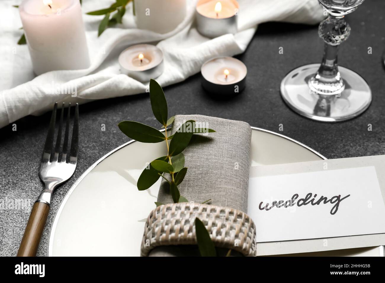 Beautiful table setting and wedding invitation on grunge background ...