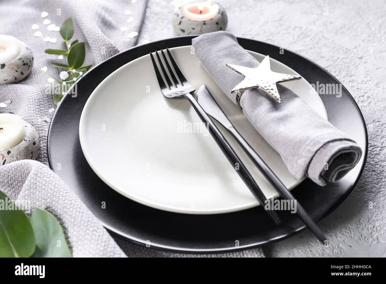 Beautiful table setting for wedding on grey background Stock Photo - Alamy