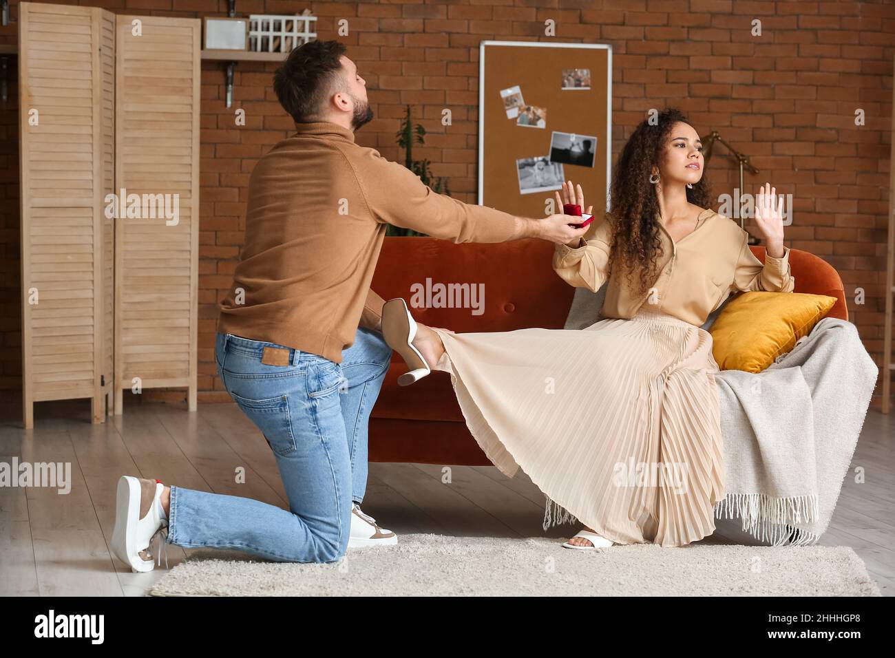Young woman rejecting marriage proposal at home Stock Photo - Alamy