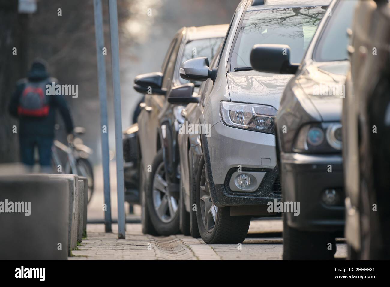 City traffic with cars parked in line on street side Stock Photo - Alamy