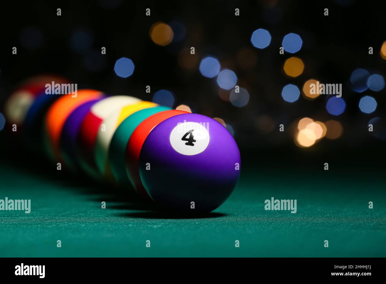Different billiard balls on green table Stock Photo - Alamy