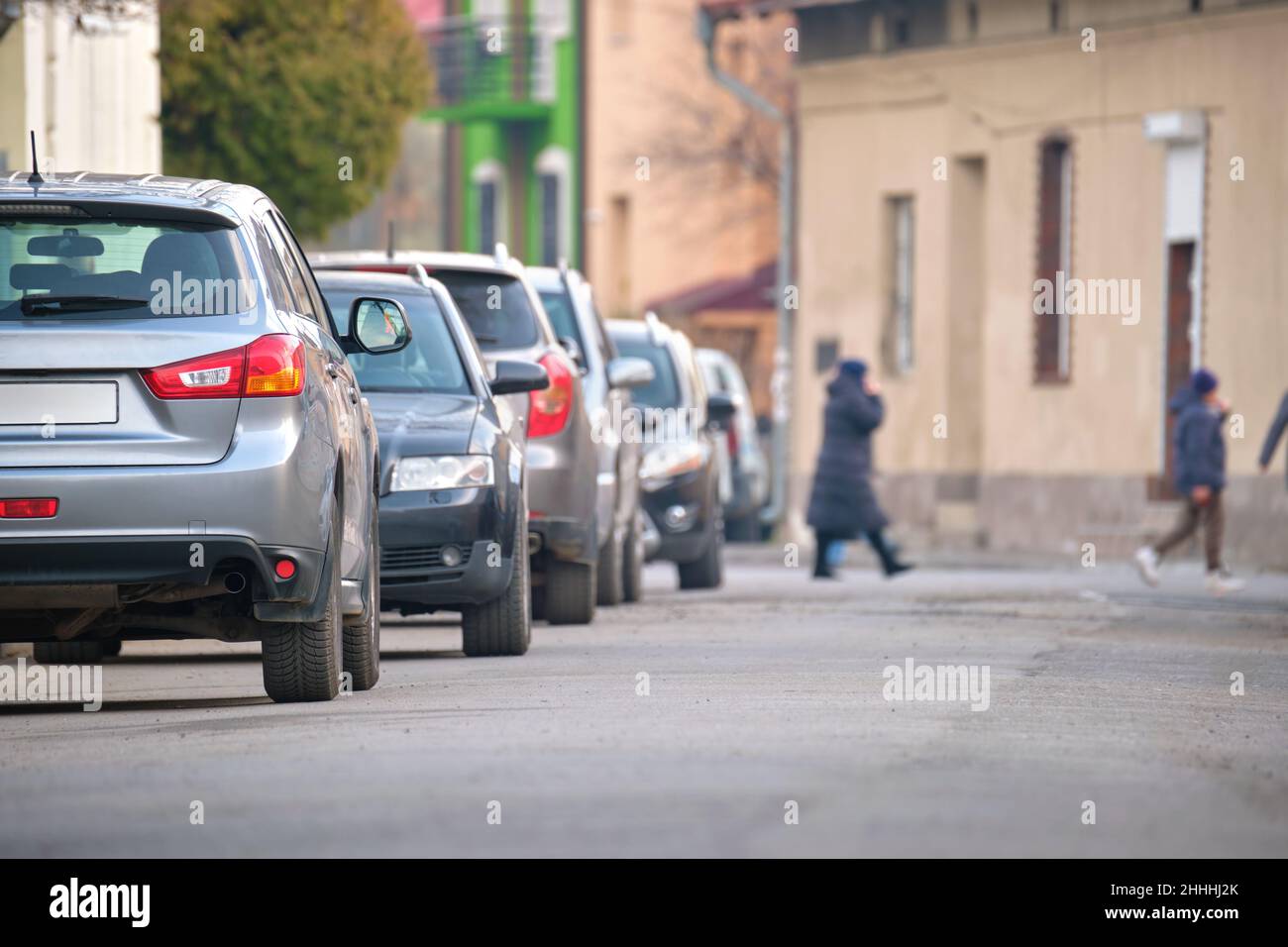 City traffic with cars parked in line on street side Stock Photo - Alamy