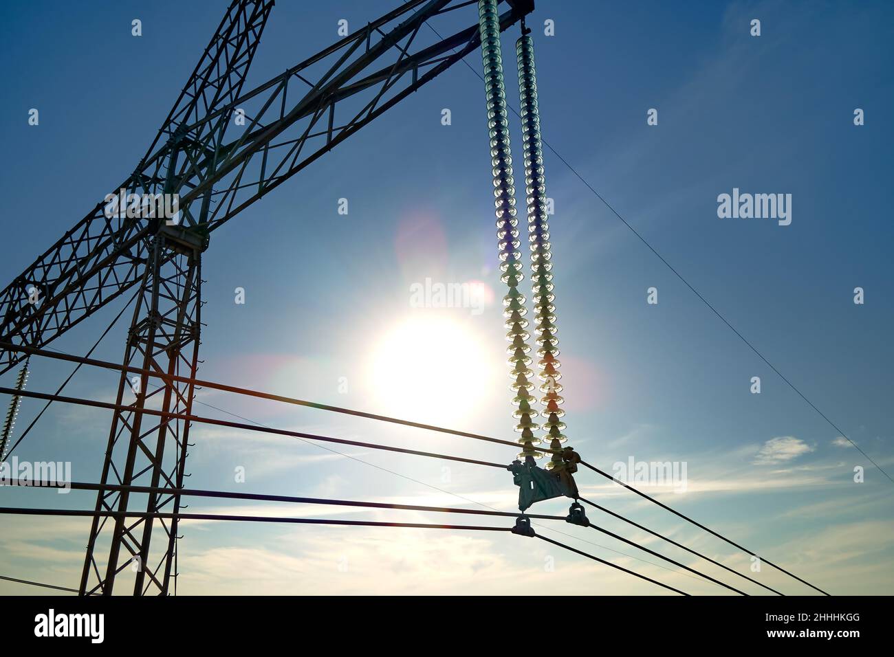 High voltage tower with electric power lines divided by safe guard ...