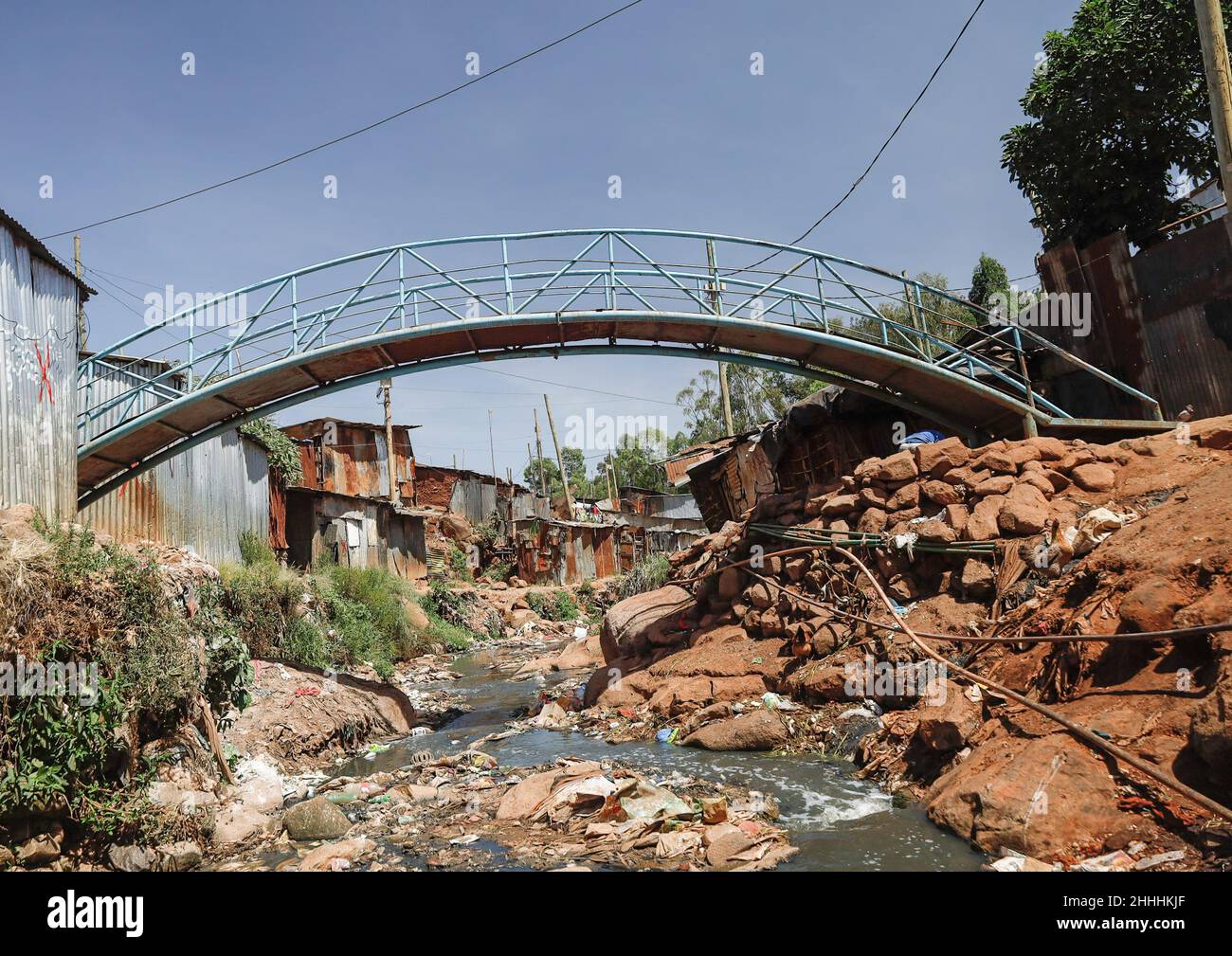 View of a local bridge that separates through a local sewer river in ...