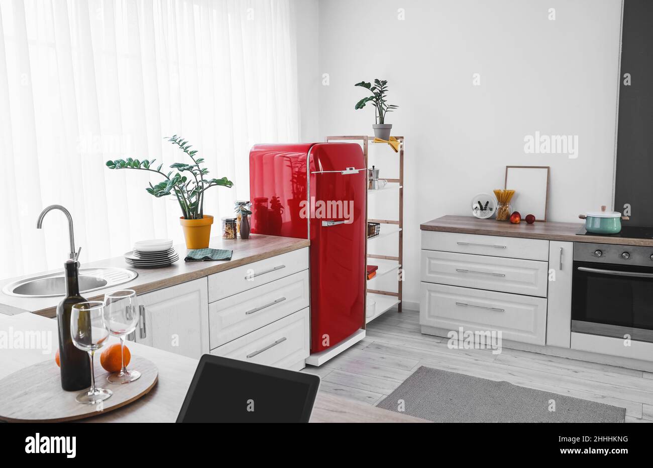 Interior of modern kitchen with refrigerator and counters Stock Photo ...