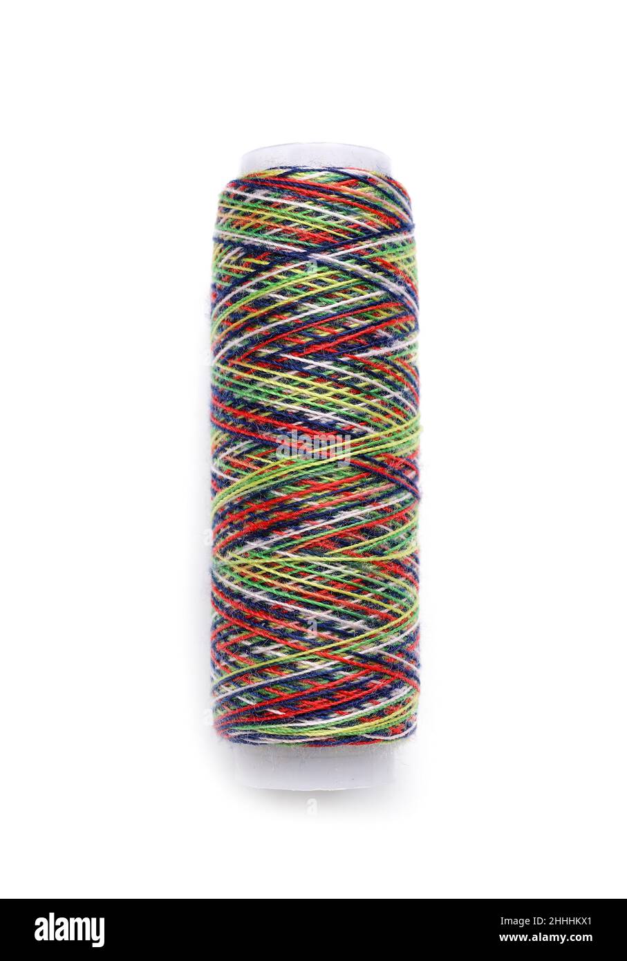 Rainbow sewing thread spool on white background Stock Photo - Alamy