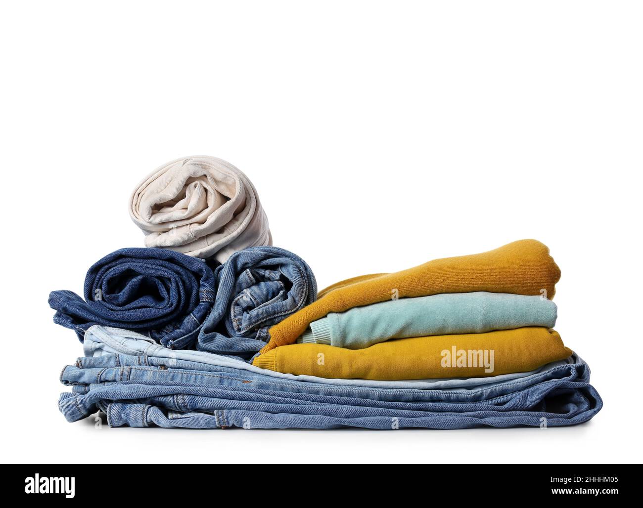 Stack of different female jeans and sweaters on white background Stock ...