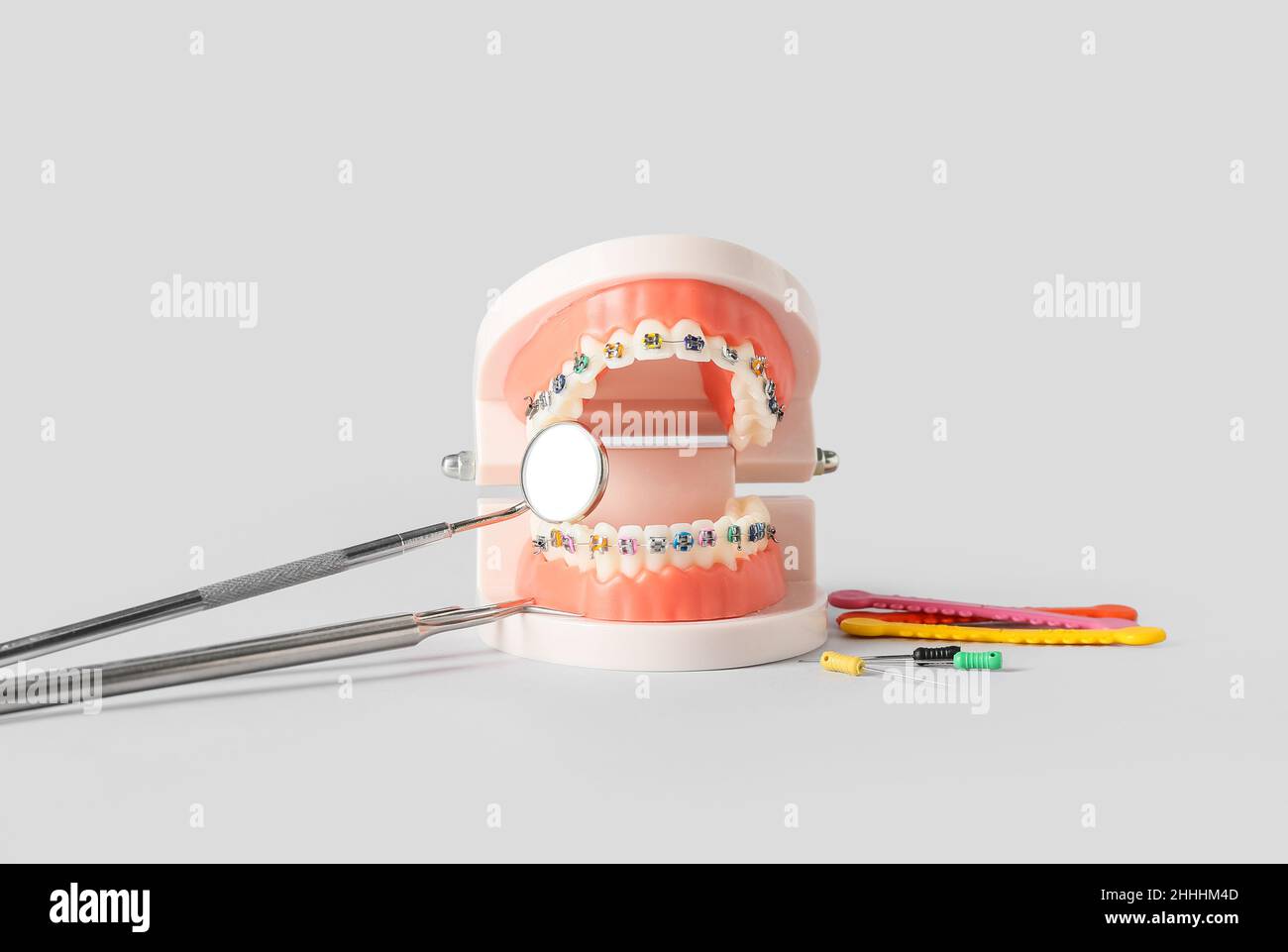 Model of jaw with braces and dental tools on white background Stock ...