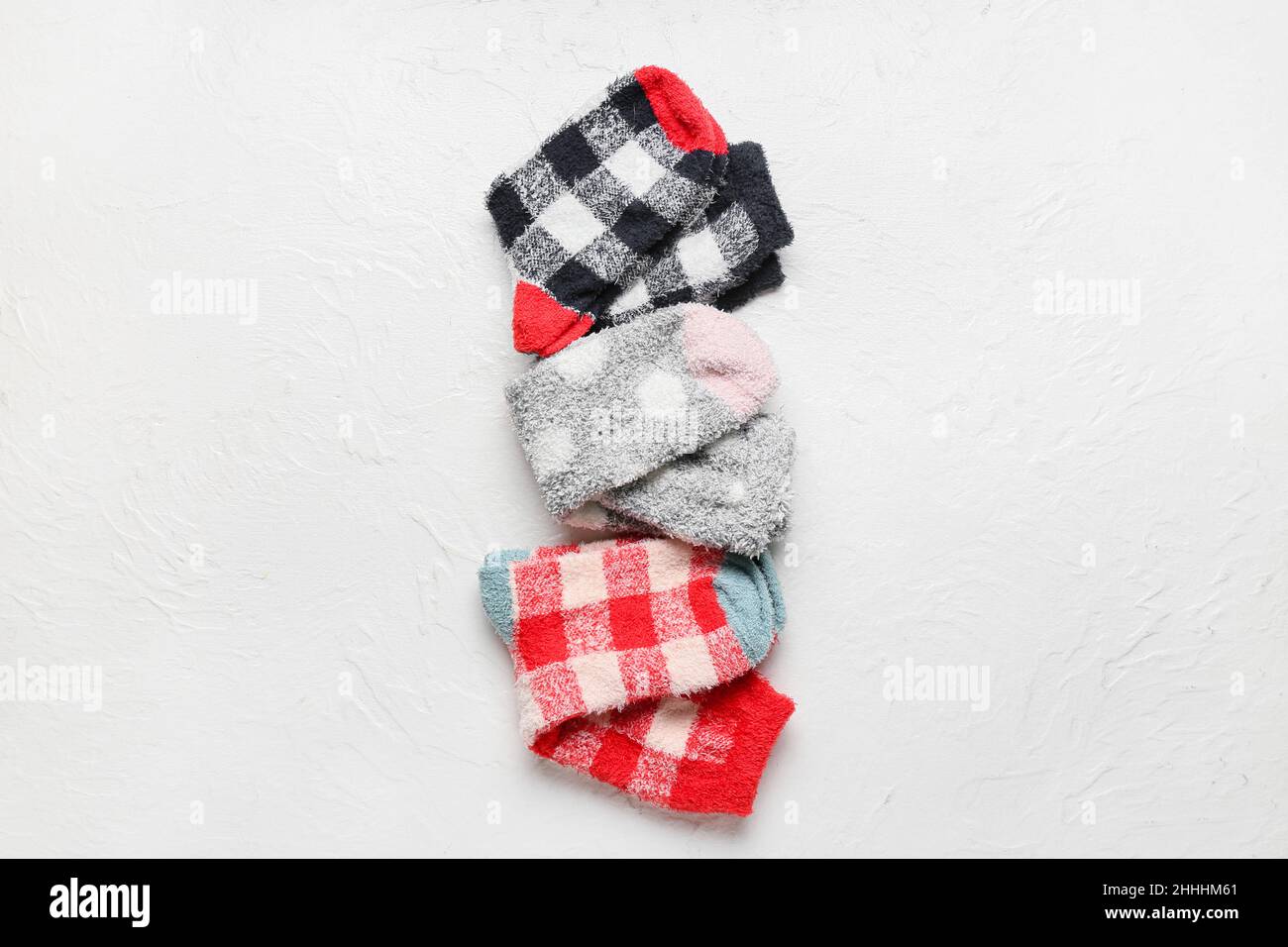 Set of warm socks on light background Stock Photo - Alamy