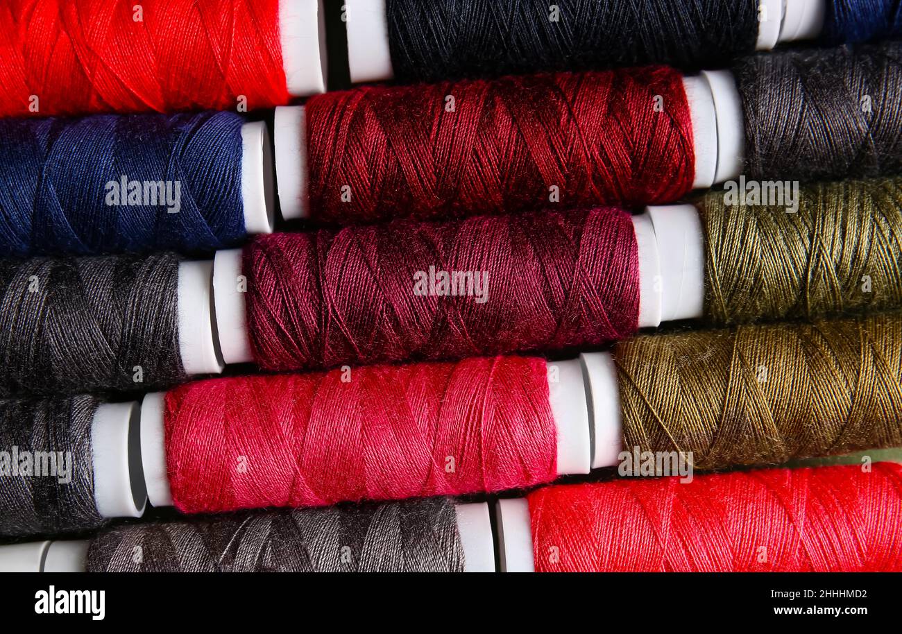 Different sewing threads as background Stock Photo - Alamy