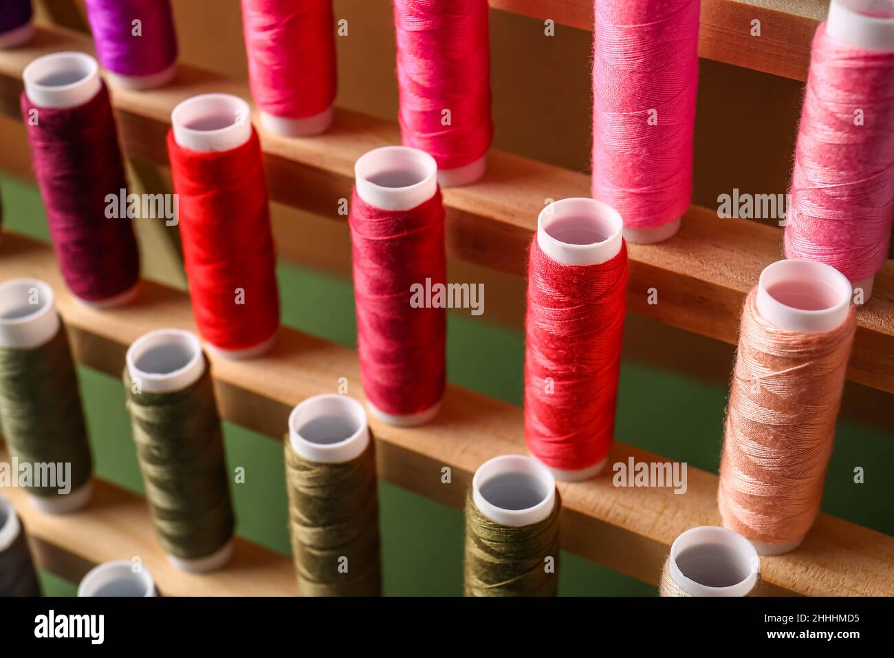 Set of different colorful sewing threads on coils Stock Photo - Alamy
