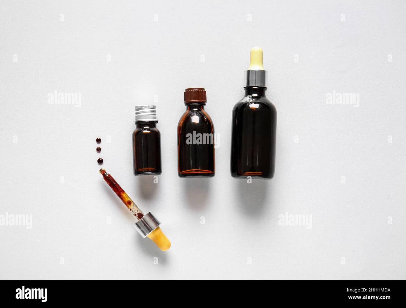 Different bottles with iodine and pipette on grey background Stock ...