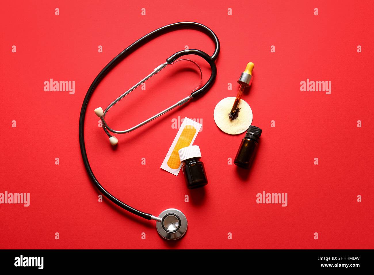 Bottles with iodine, pipette, cotton pad, medical plaster and ...