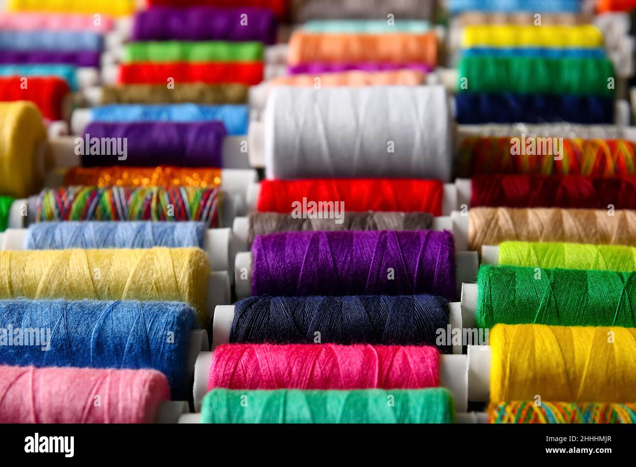 Set of spools with colorful sewing threads, closeup Stock Photo - Alamy