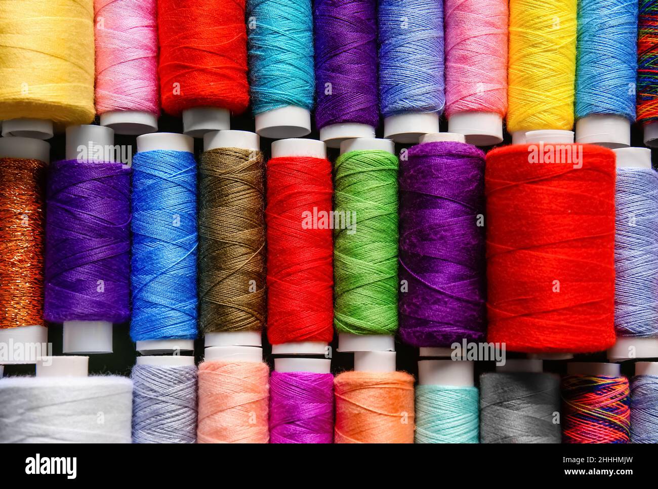 Set of spools with different sewing threads, closeup Stock Photo - Alamy