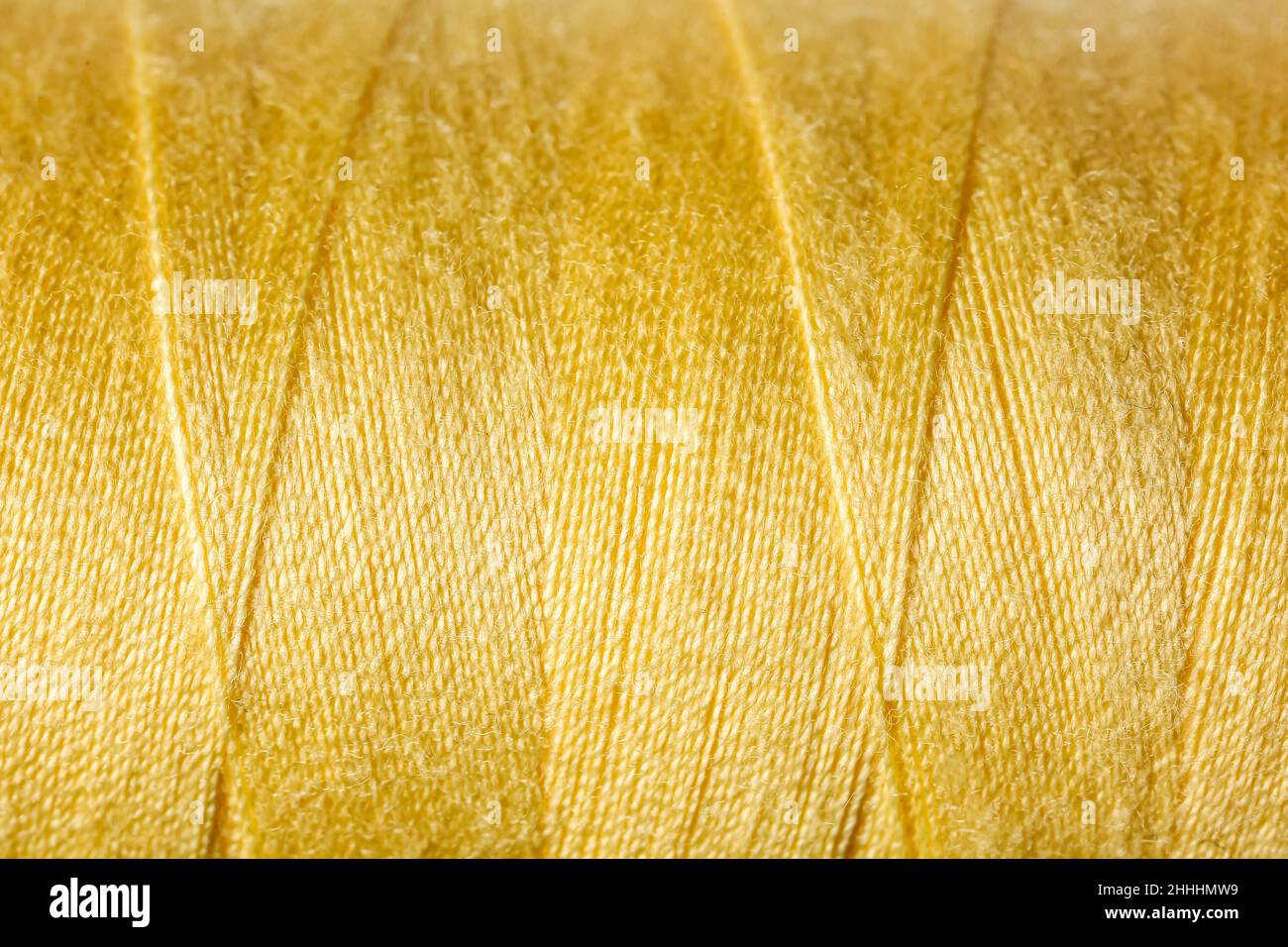 Closeup view of yellow threads as background Stock Photo - Alamy