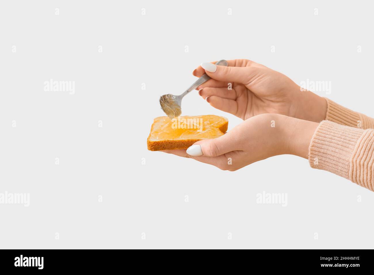 Hands female spreading jam toast hi-res stock photography and images ...