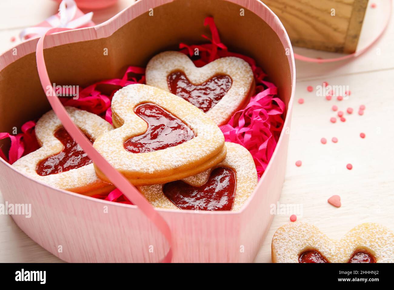 Box with tasty cookies in heart shape on light background Stock Photo ...