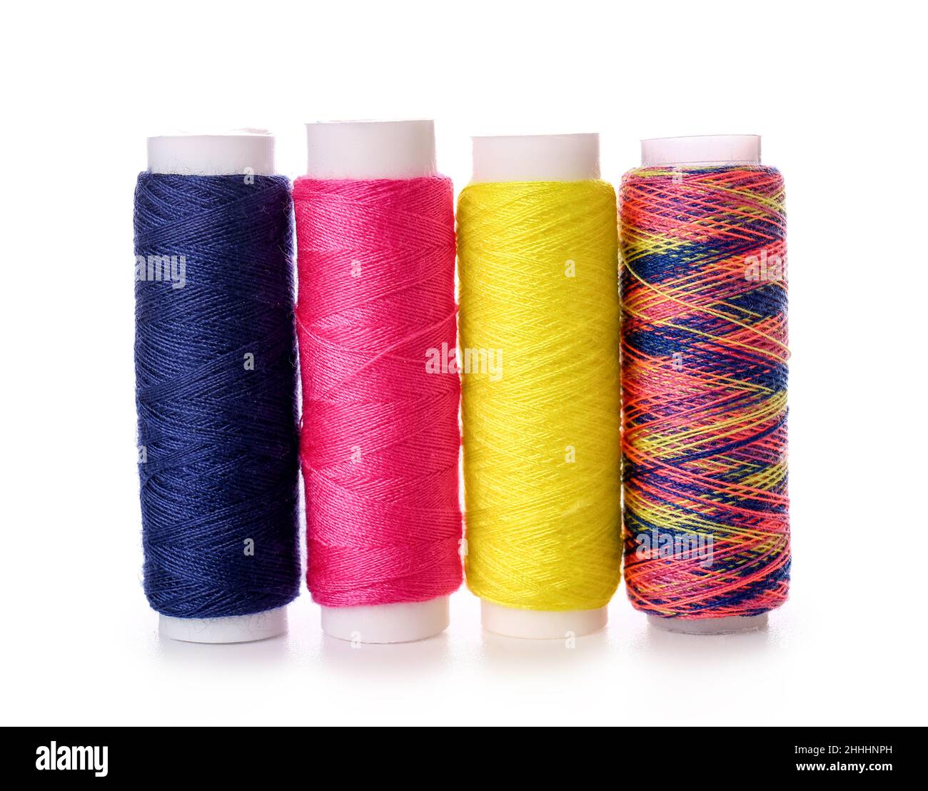 Different sewing thread spools on white background Stock Photo - Alamy