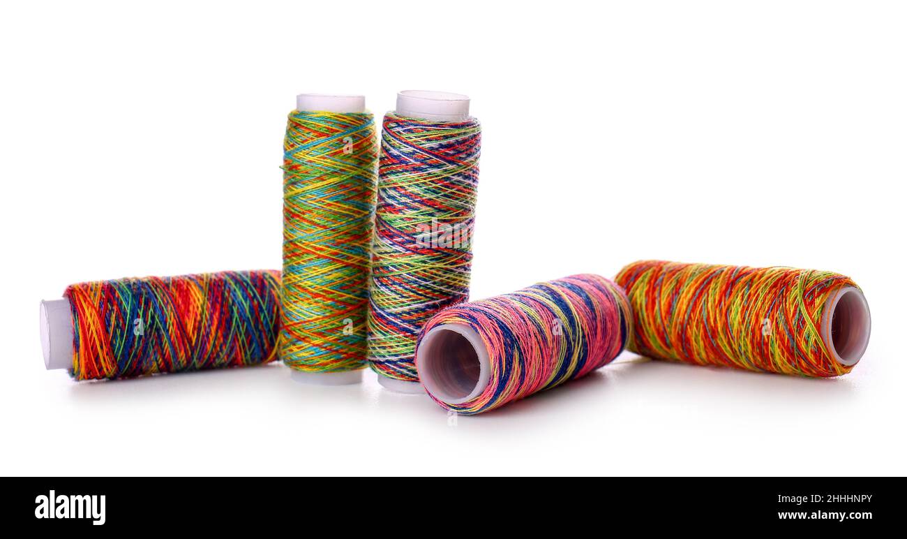 Sewing thread spools on white background Stock Photo - Alamy