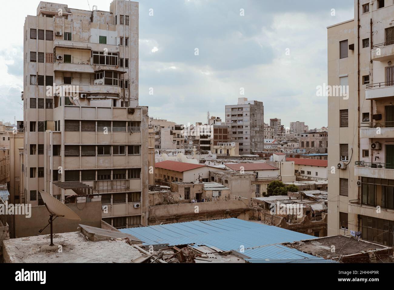 Alexandria, Egypt - 12.11.2021: Old poor buildings rooftops with cables ...