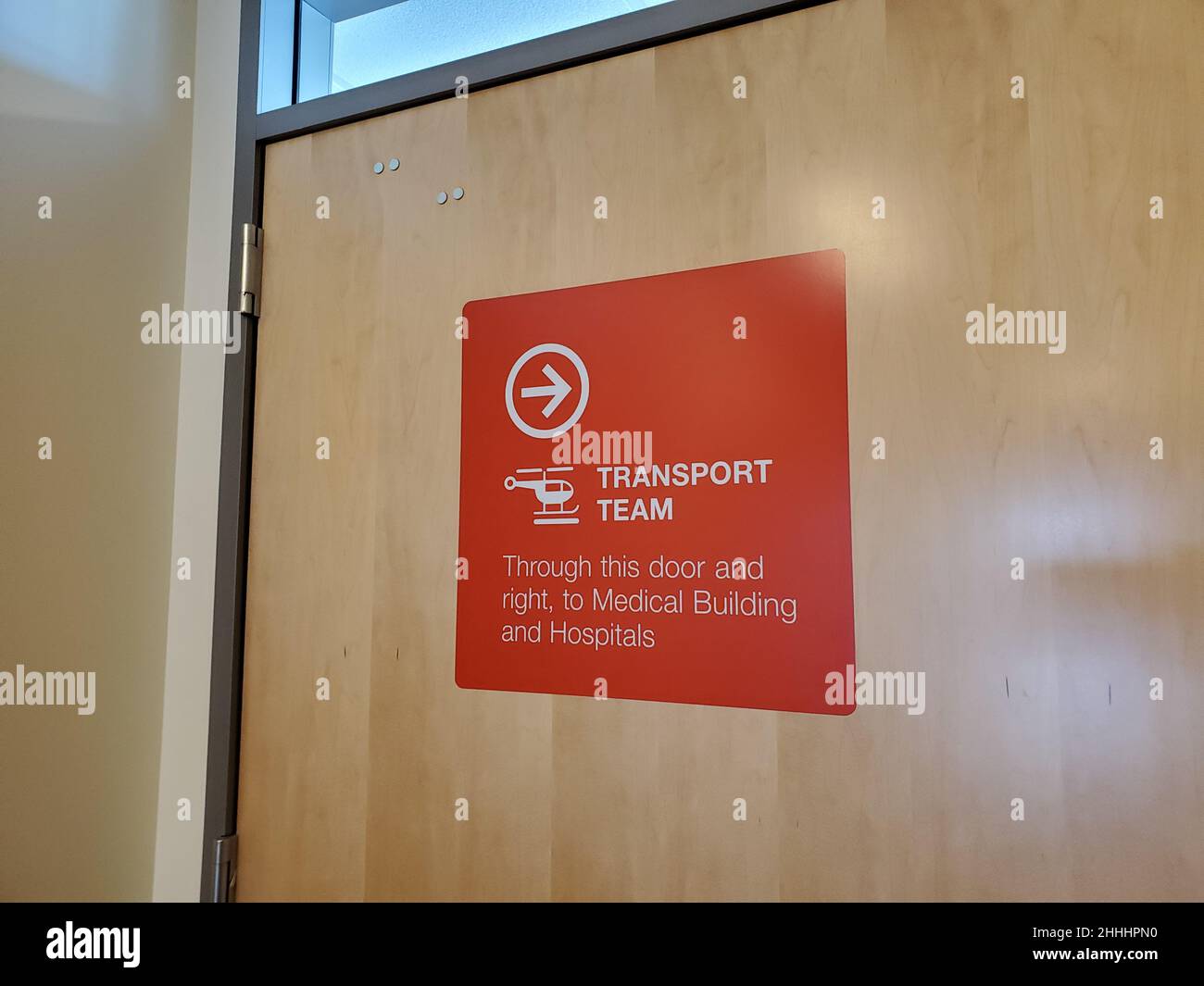 Close-up of a red and white "Transport Team" sign, with arrow and ...