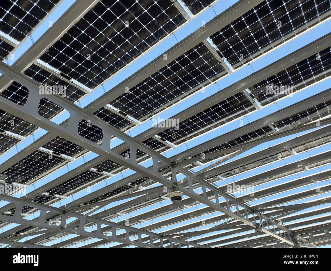 Low-angle view of metal trusses supporting solar panels in San Ramon ...