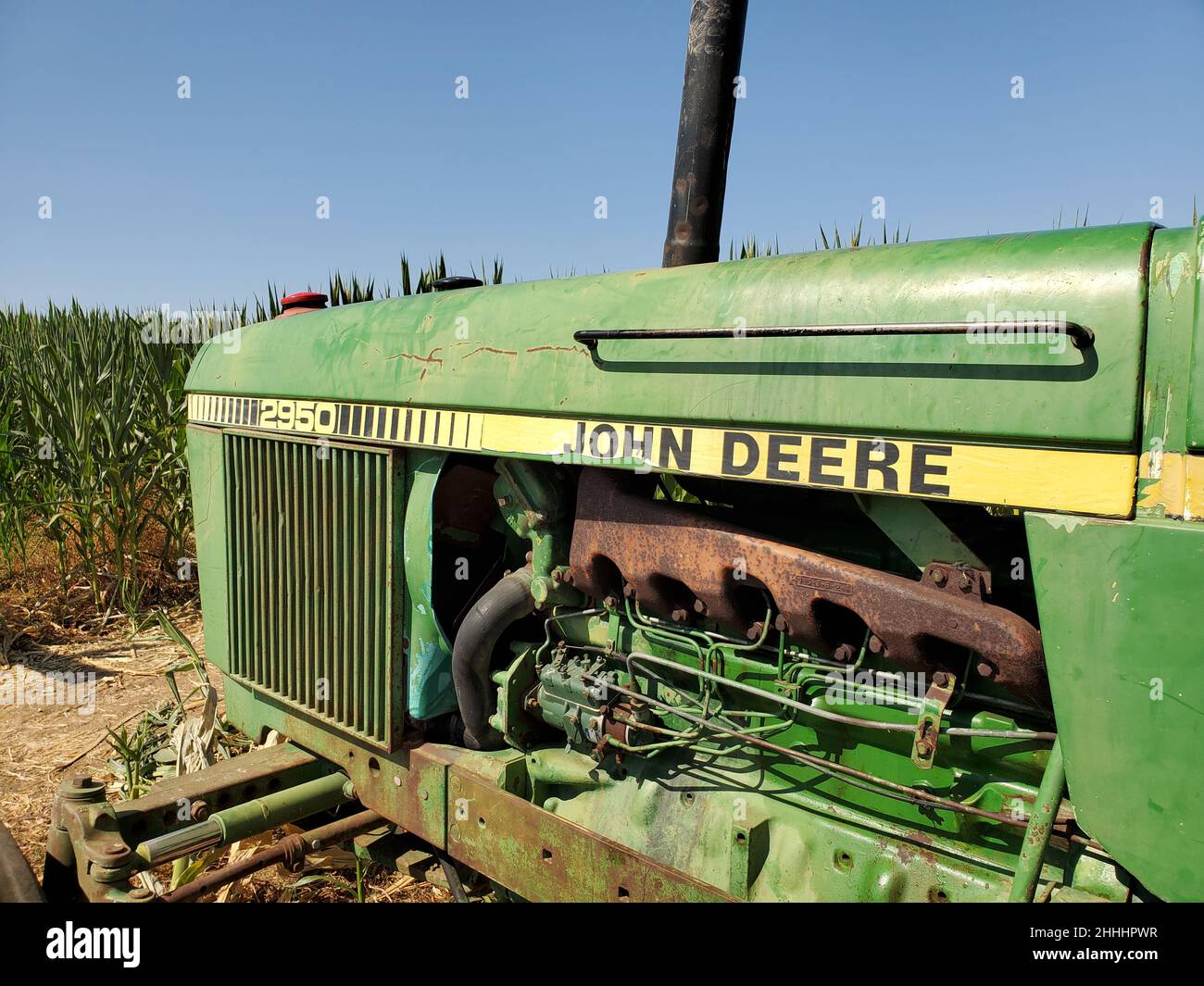 Close-up of engine compartment of vintage tractor with John Deere logo ...