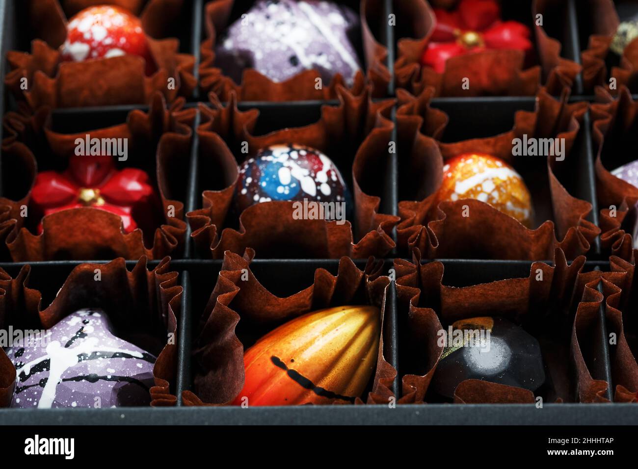 Sweet handmade chocolates in a box. The art of chocolate Stock Photo ...