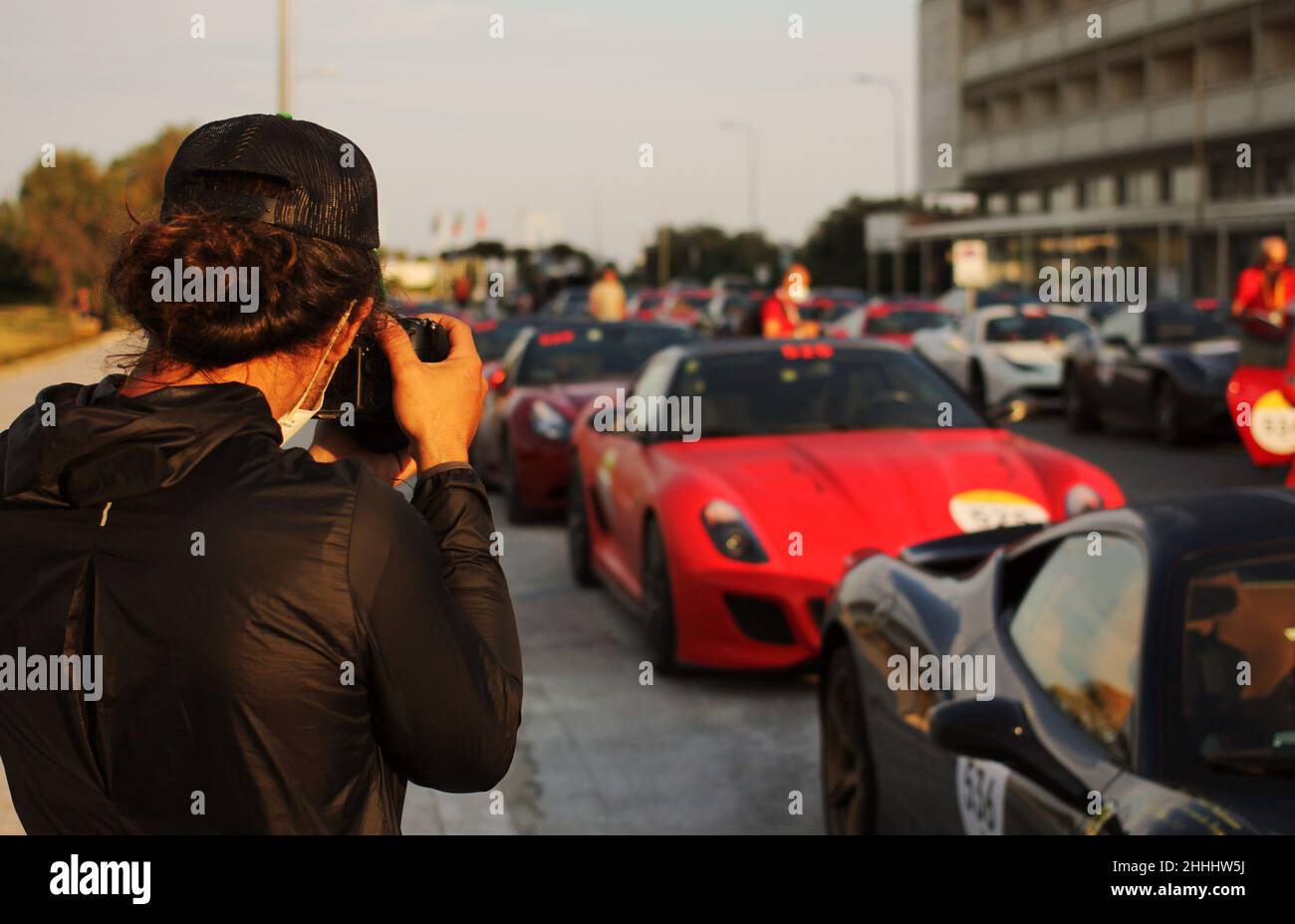 Reporter taking a picture during a car show concept of school for ...