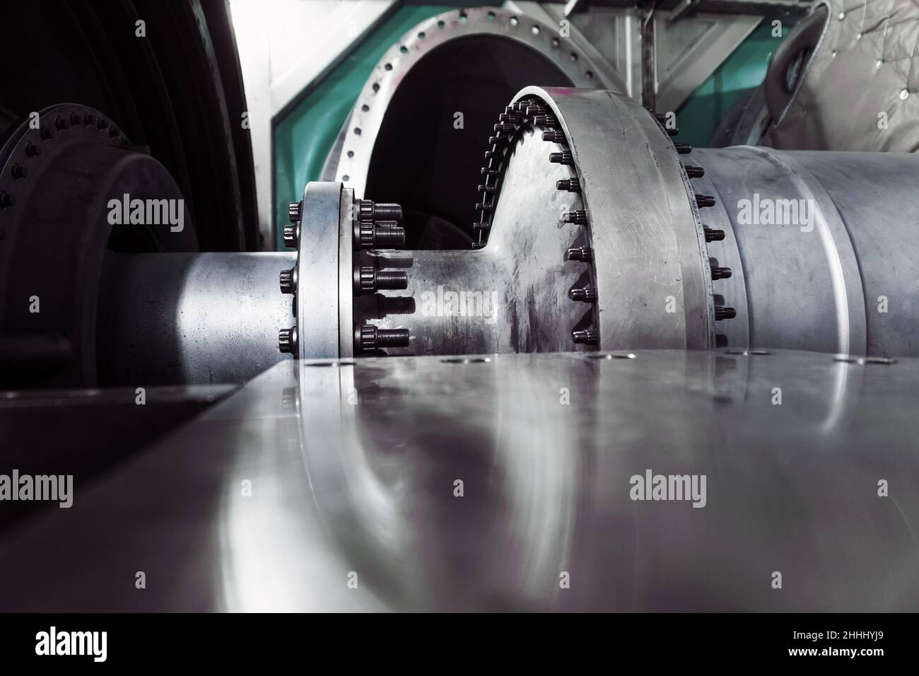 The rotor of a gas turbine compressor with a bolted coupling half ...